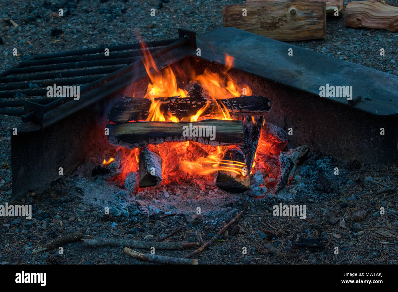 A Campfire Burns at The Campground Stock Photo - Alamy