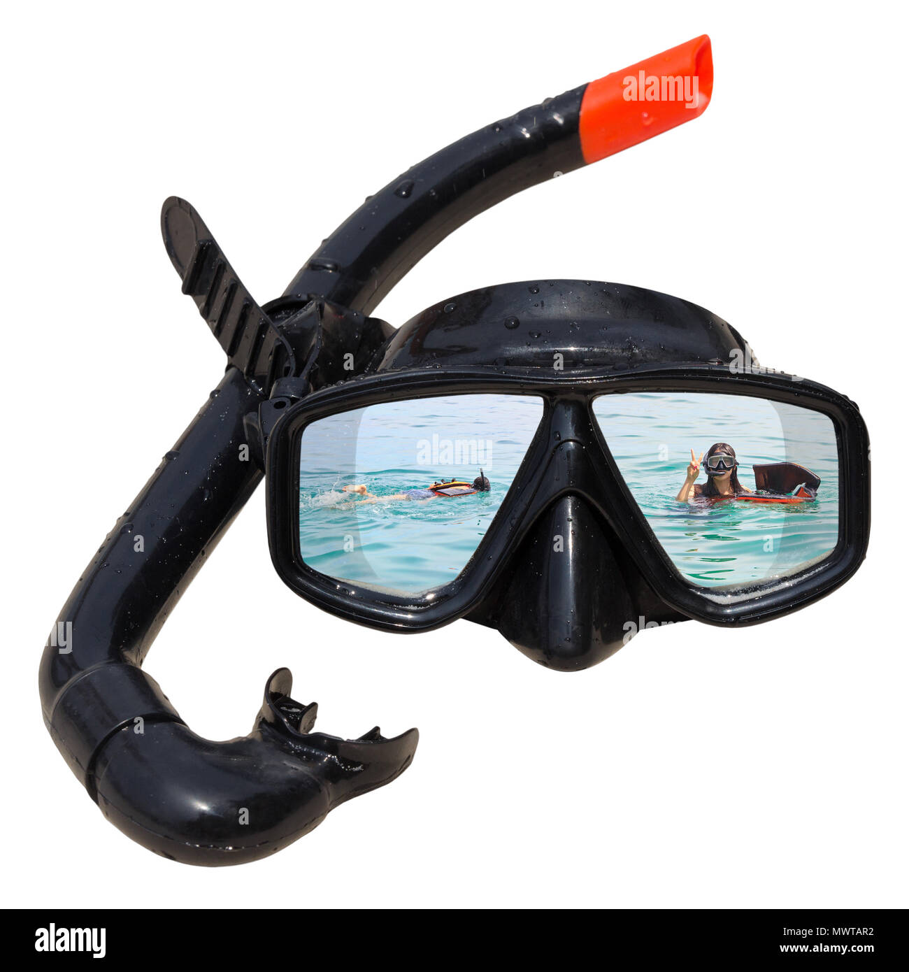 Women diving at ocean is reflected in diving mask and snorkel on the ...