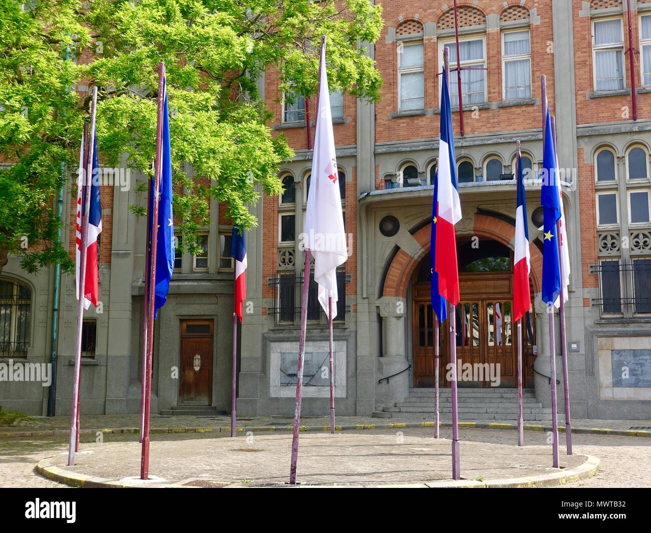 Flags of Lille, France, and the European Union in a circle in front of ...