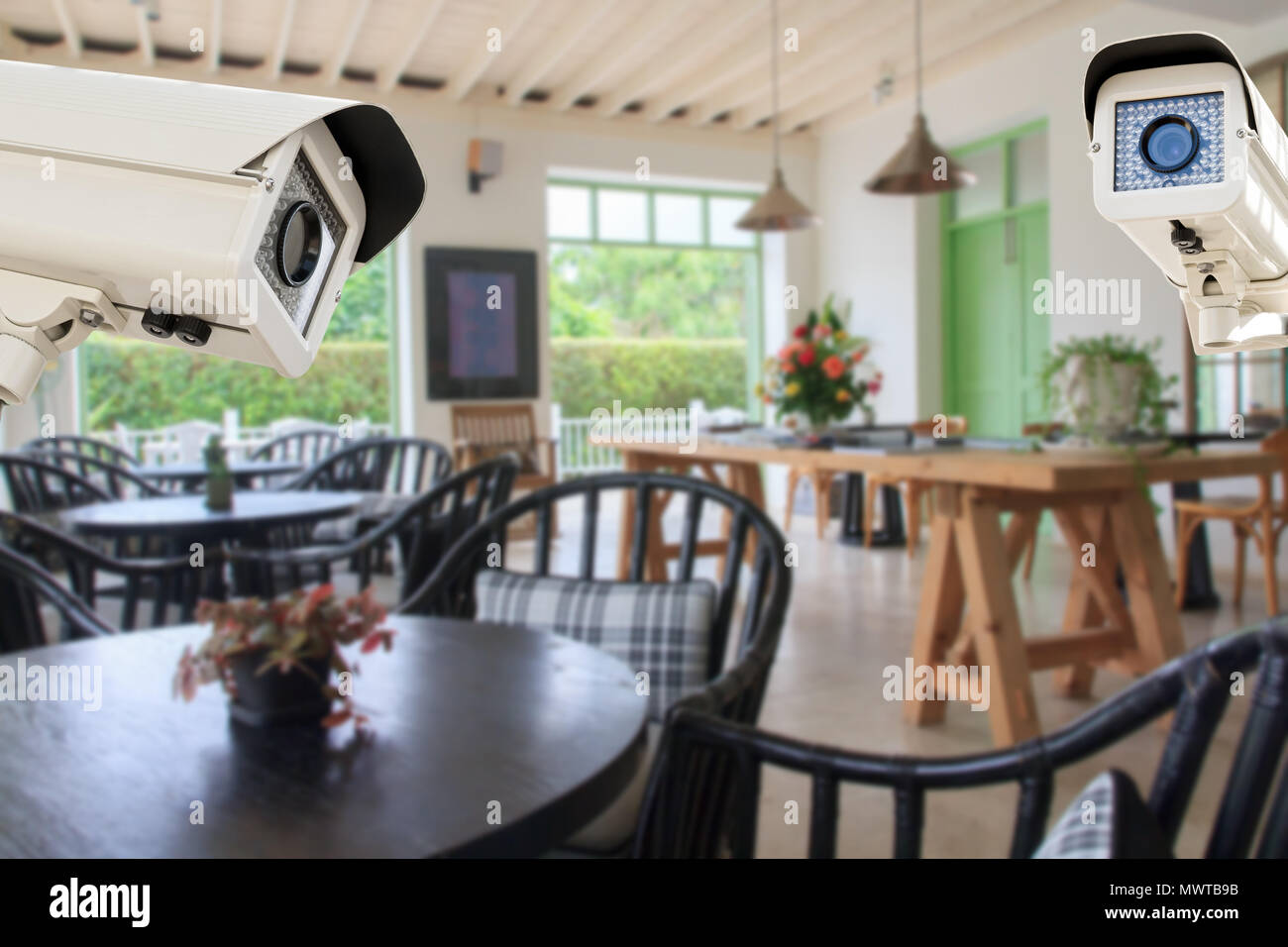 The CCTV Security Camera operating in the coffee shop blur background ...