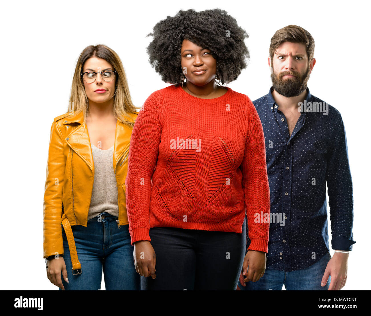 Group of three young men and women making funny face fooling Stock ...