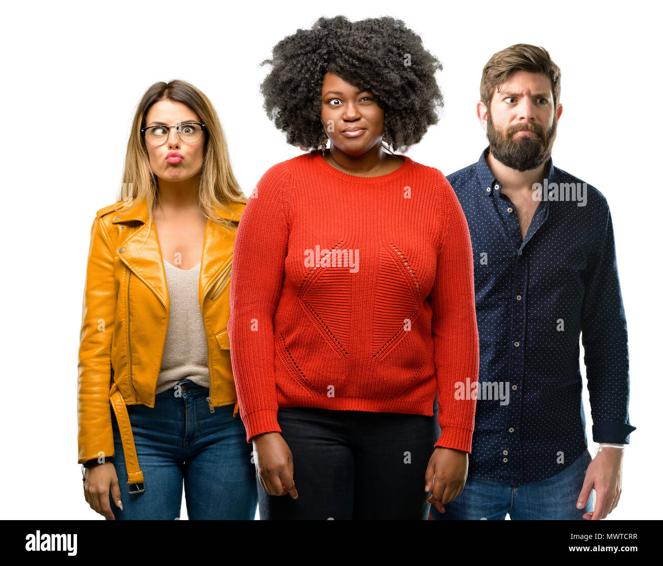 Group of three young men and women making funny face fooling Stock ...