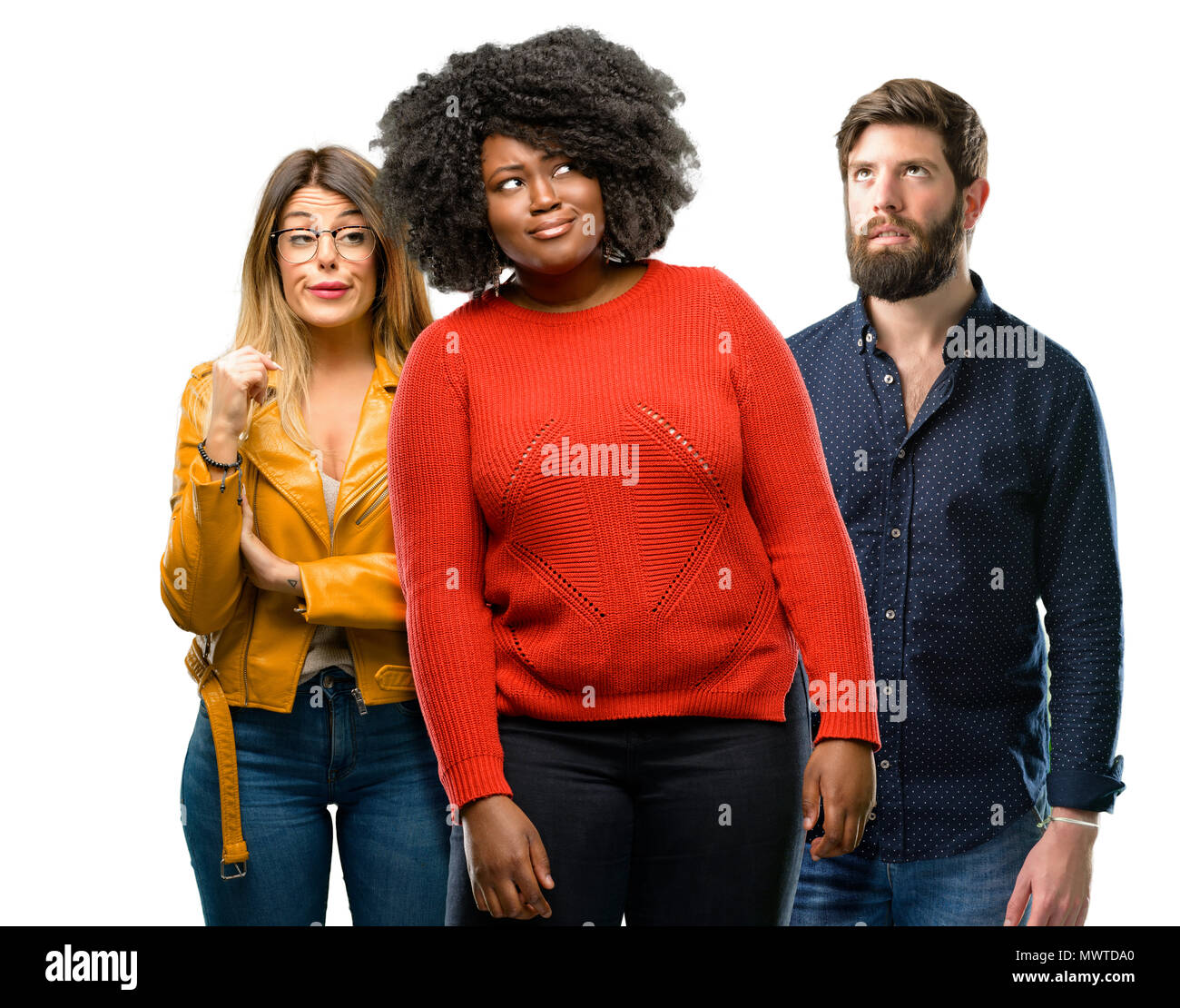 Group of three young men and women making funny face fooling Stock ...