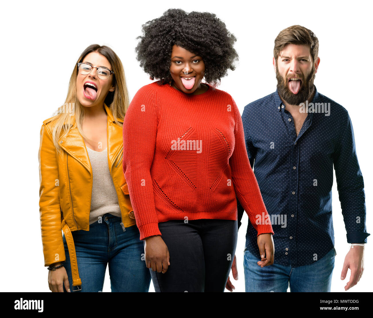 Group of three young men and women sticking out tongue at camera at ...