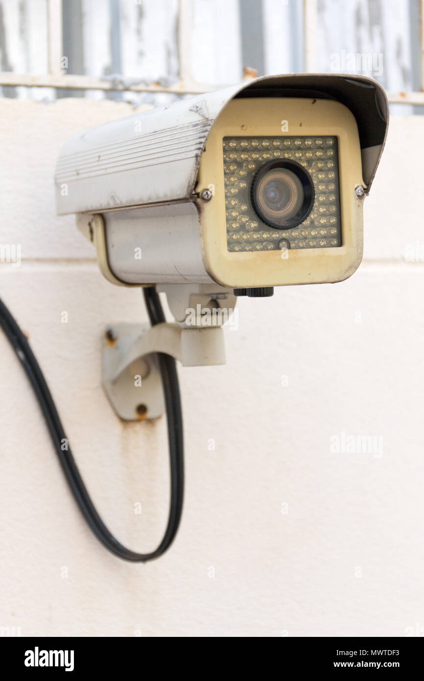 The Old CCTV Security Camera operating long time on wall Stock Photo ...