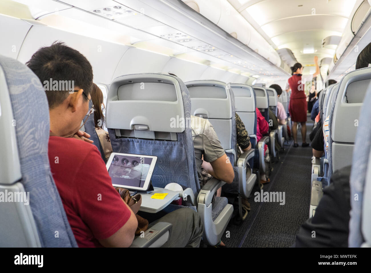 Air China,stewardess,crew,inside,cabin,serving,food,drinks,on,flight ...