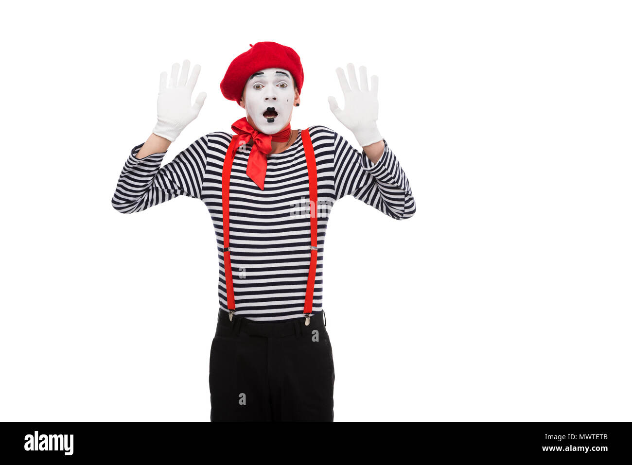 shocked mime standing with hands up isolated on white Stock Photo - Alamy