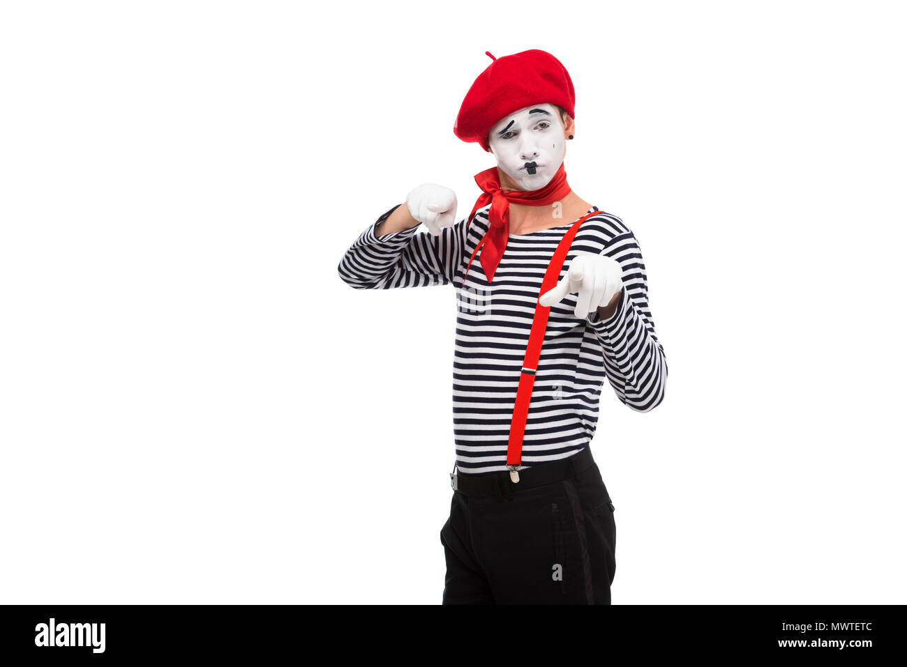 grimacing mime pointing on camera isolated on white Stock Photo - Alamy