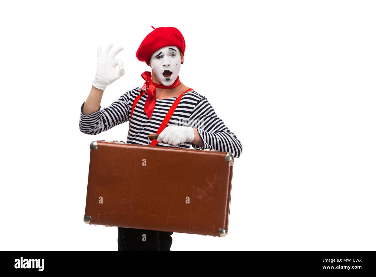 mime holding brown suitcase and showing ok sign isolated on white Stock ...