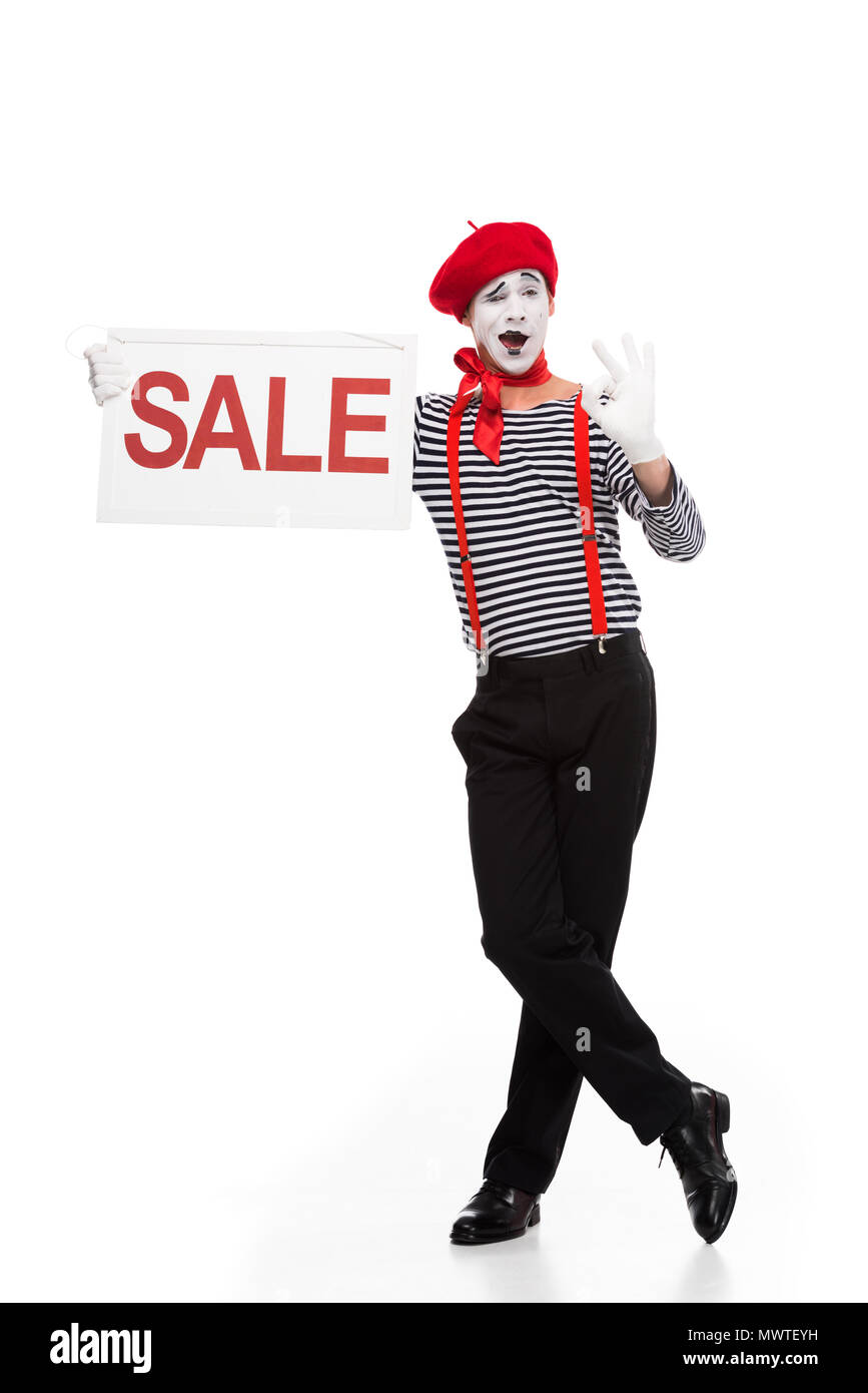 mime holding sale signboard and showing ok sign isolated on white Stock ...