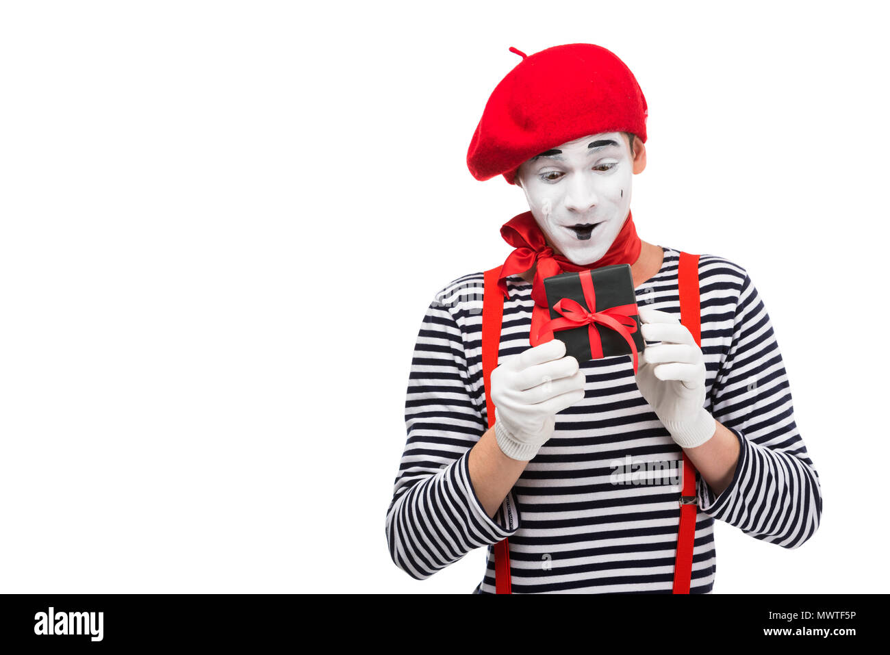 surprised mime looking at present box isolated on white Stock Photo - Alamy