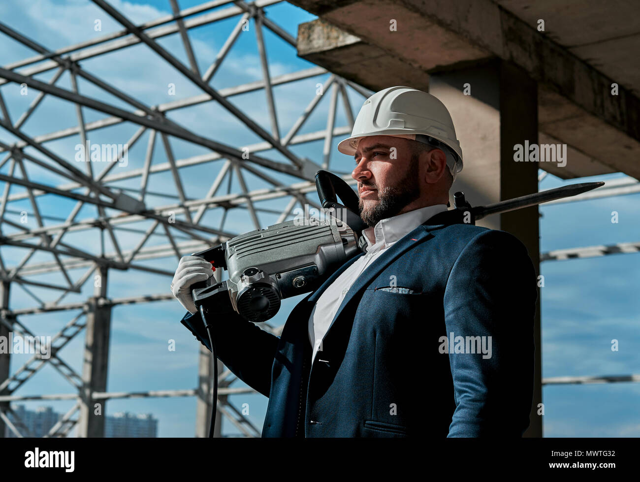 man in a helmet on the construction site Stock Photo - Alamy