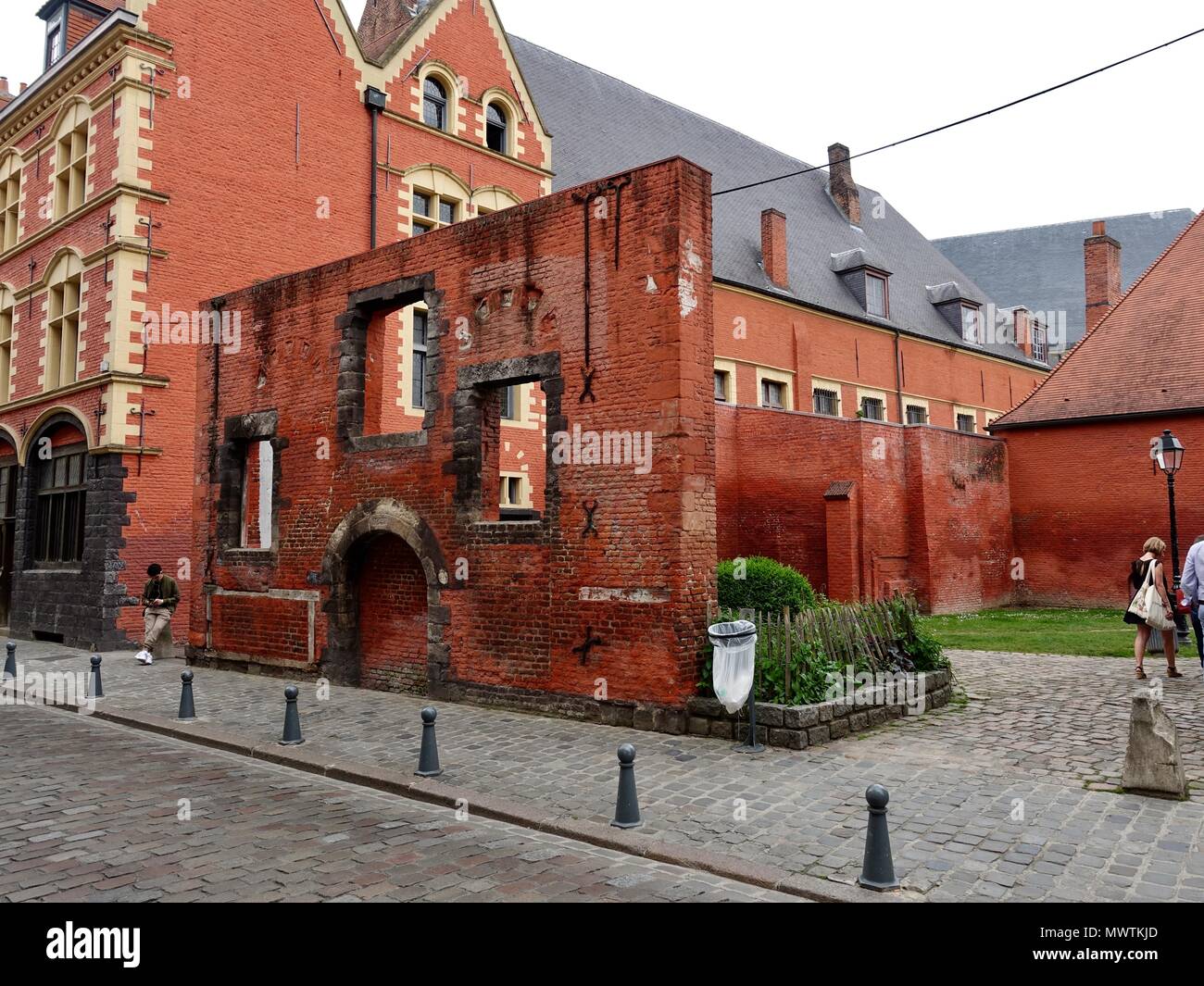 Red brick buildings with people, Lille, France Stock Photo - Alamy