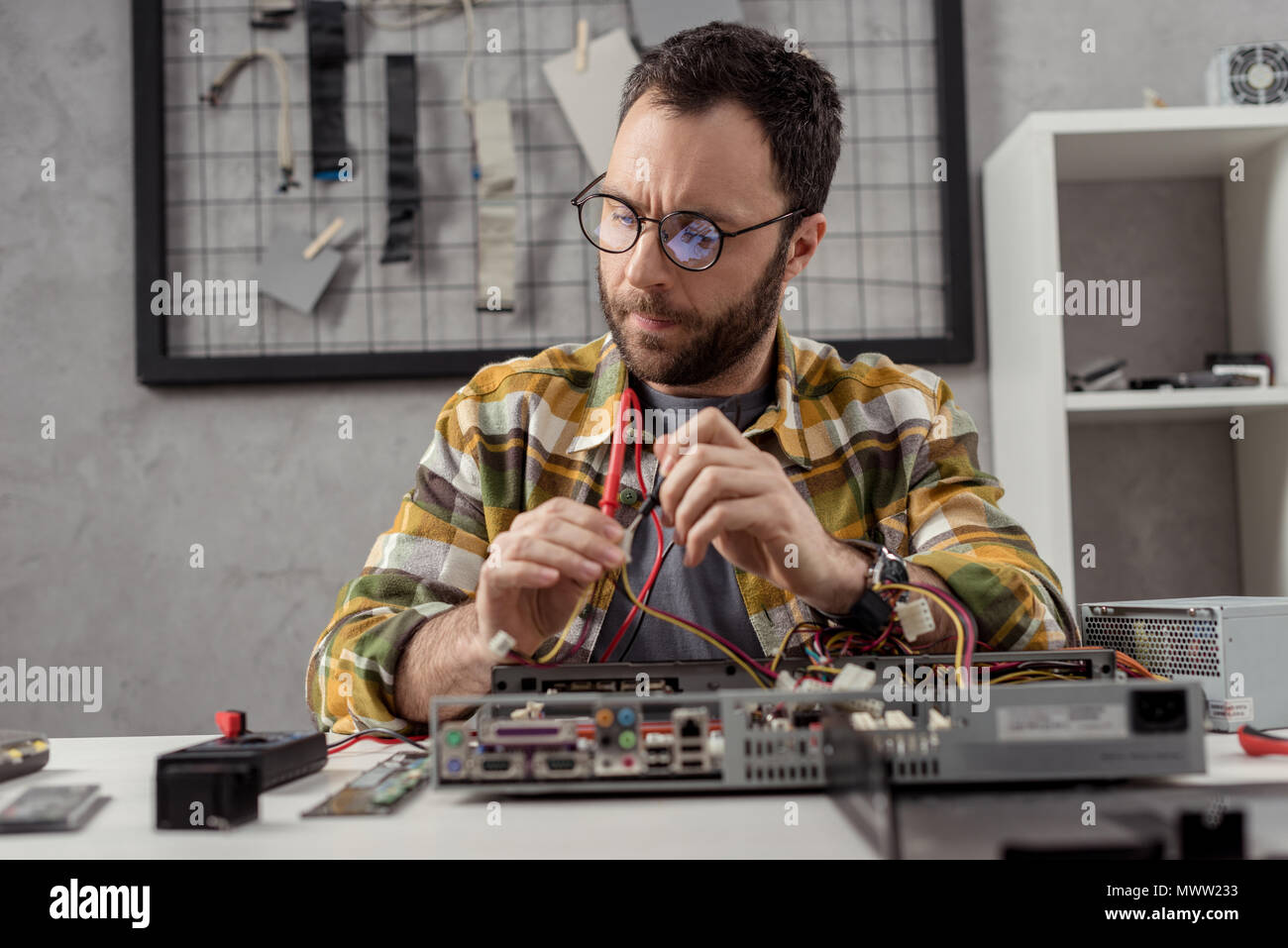 man using multimeter while fixing pc Stock Photo - Alamy