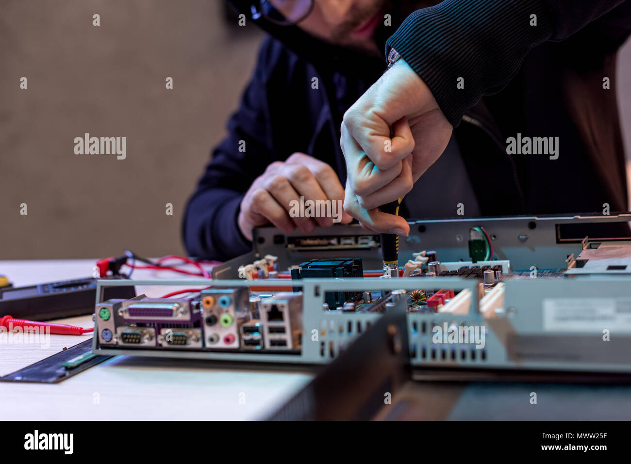 cropped image of man fixing computer Stock Photo - Alamy