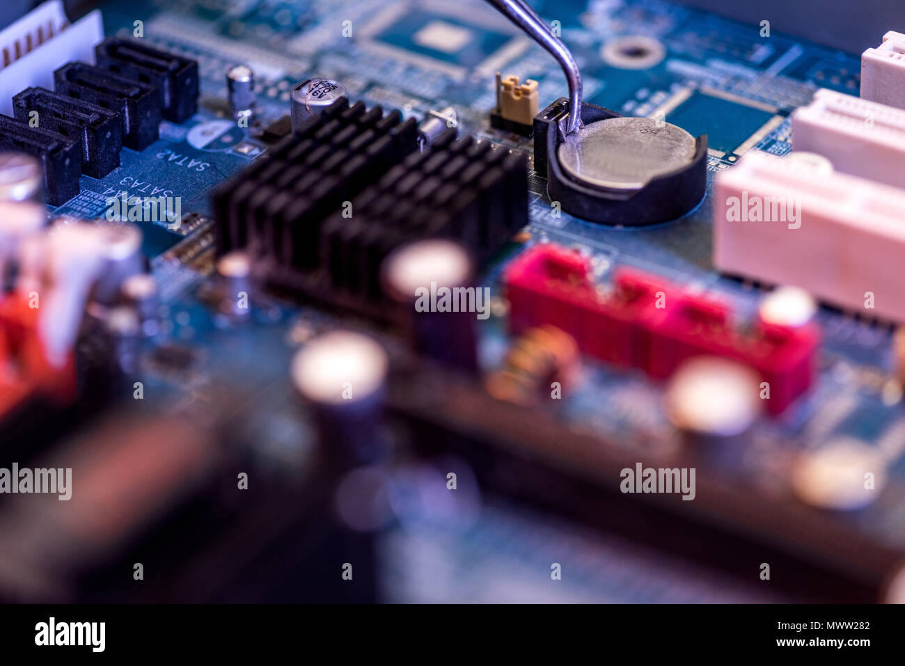 close up of motherboard and battery in socket Stock Photo - Alamy