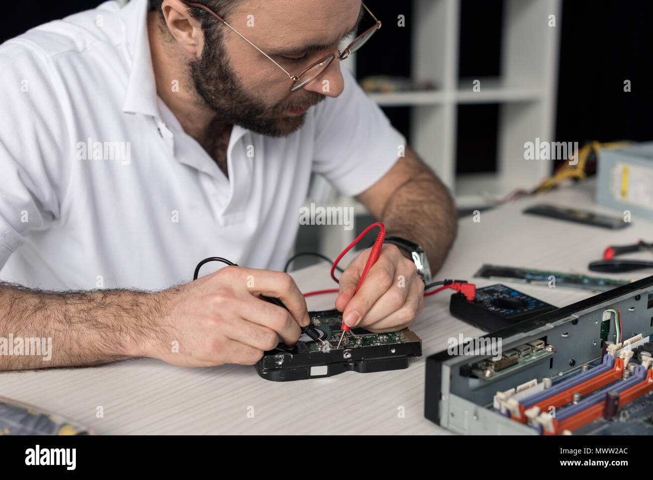 repairman using multimeter while testing hard disk drive Stock Photo ...