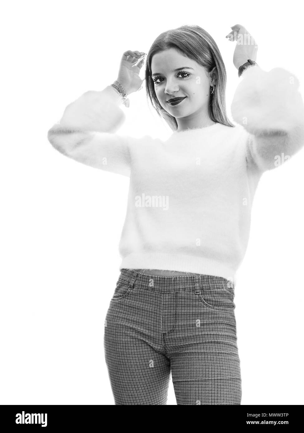 Girl standing and smiling on white background Stock Photo - Alamy