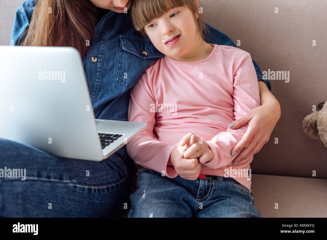 Mother and daughter with down syndrome using laptop Stock Photo - Alamy