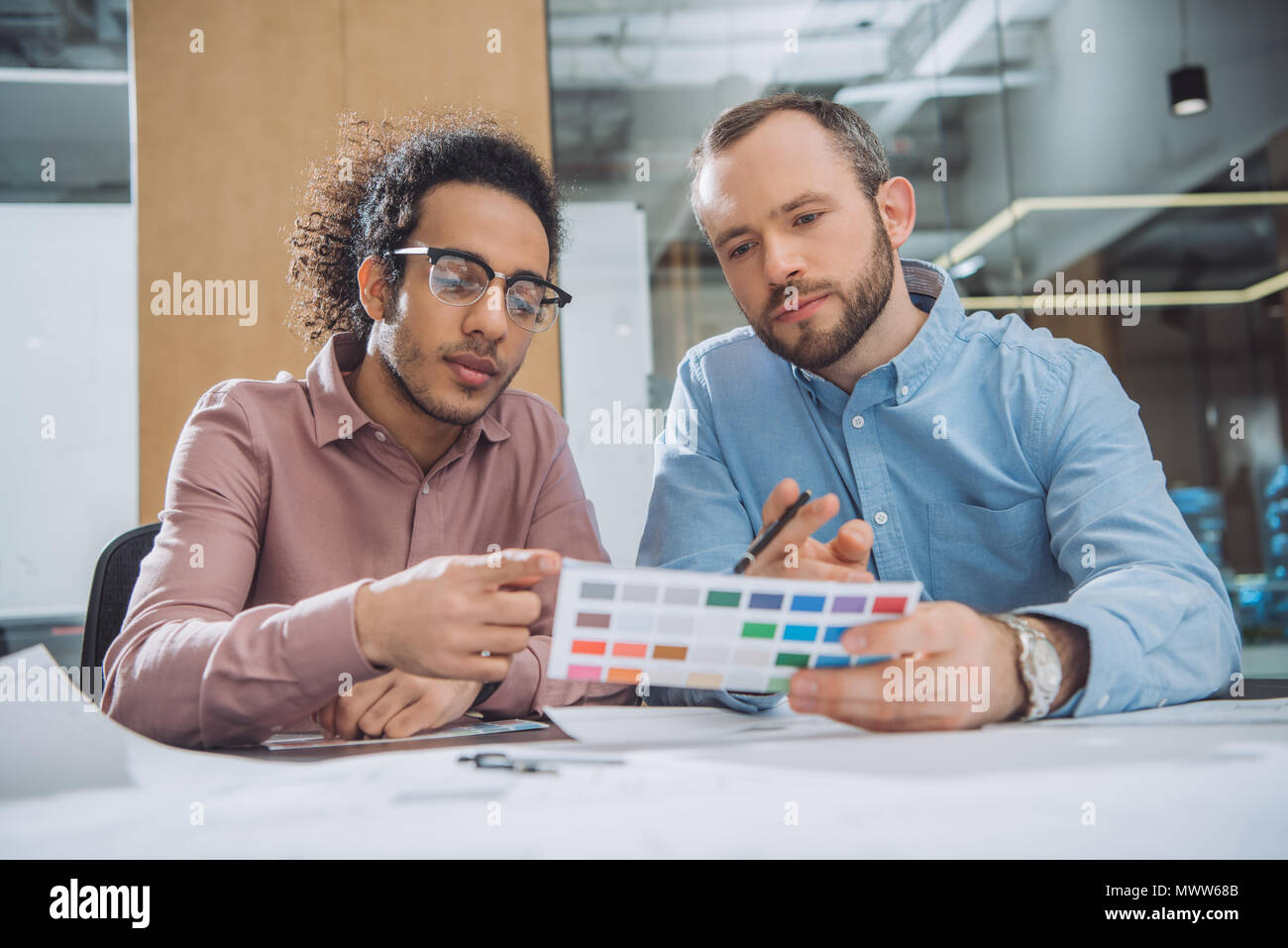 designers choosing colors from palette for project at office Stock ...