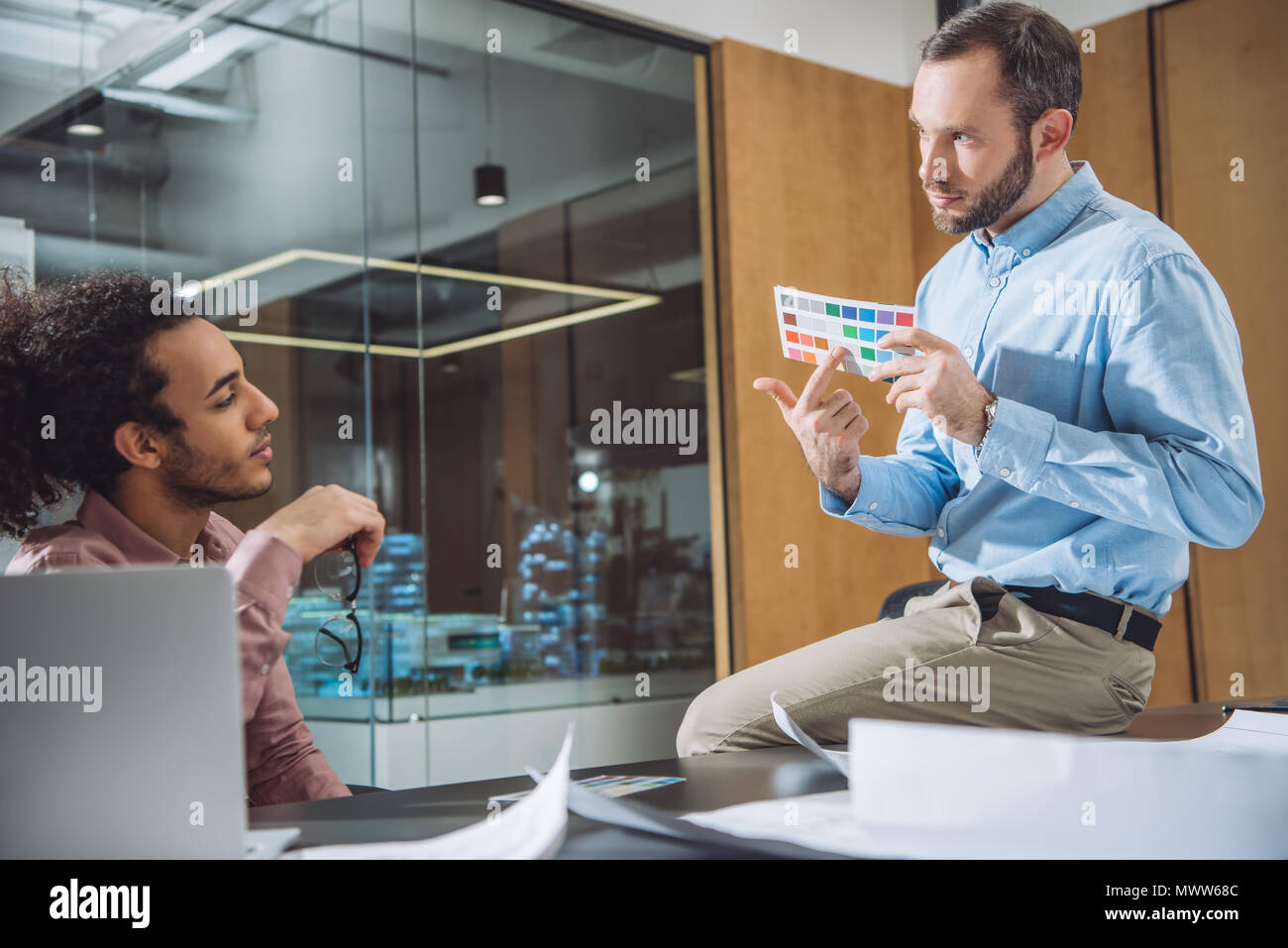 brainstorming designers choosing colors from palette for project Stock ...