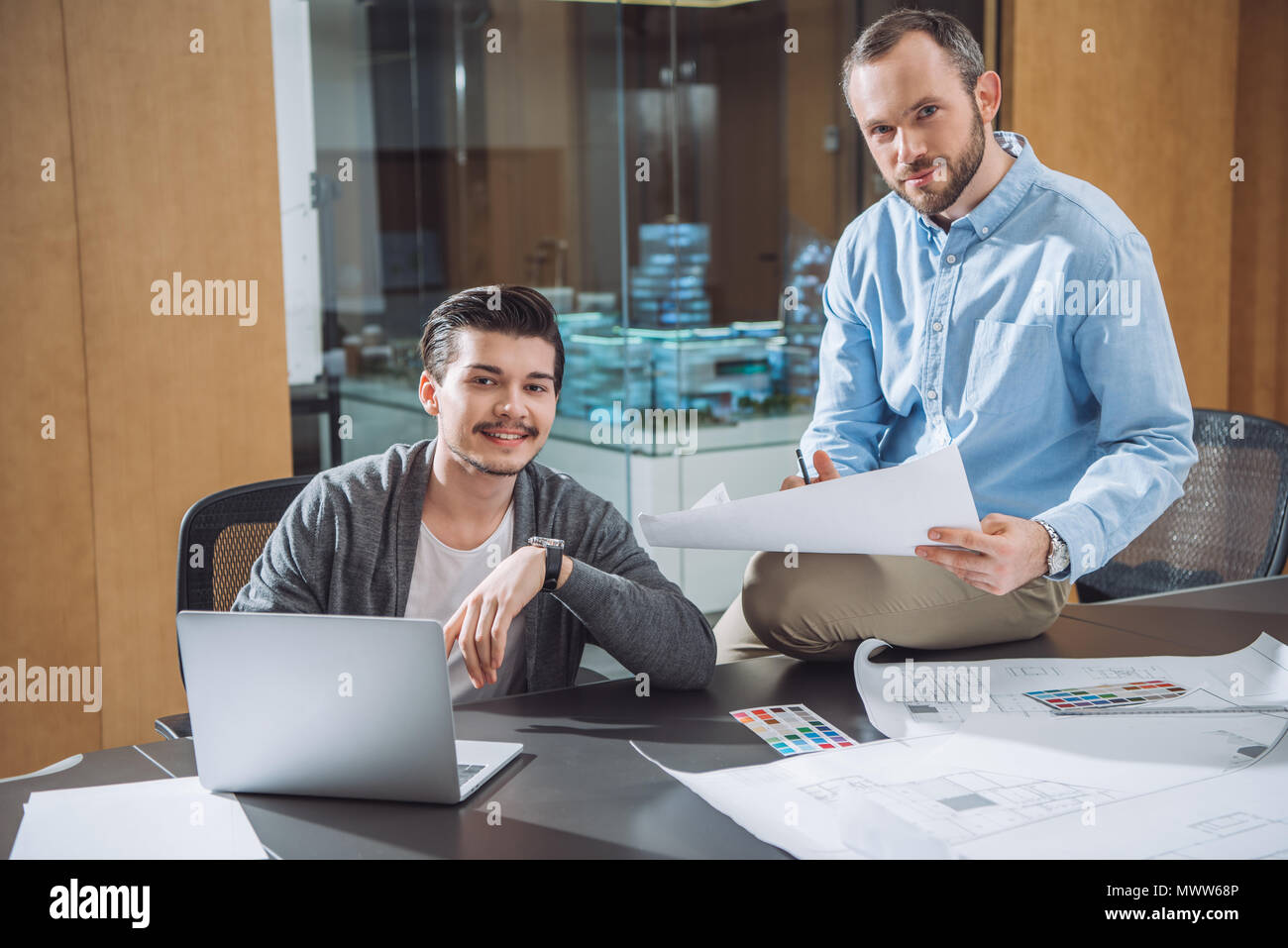 creative designers working on project together at modern office Stock ...