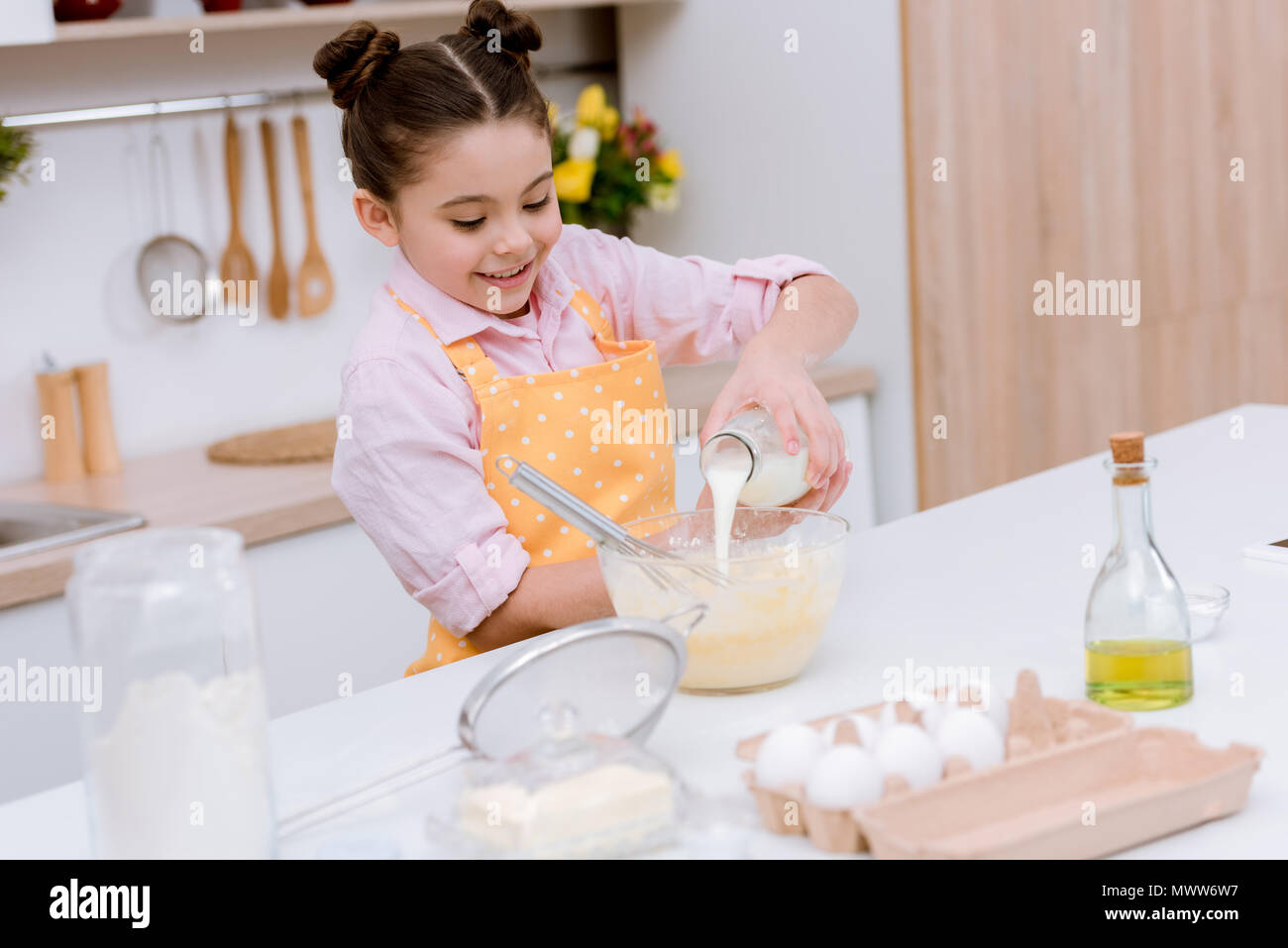 happy little child mixing dough for pastry Stock Photo - Alamy