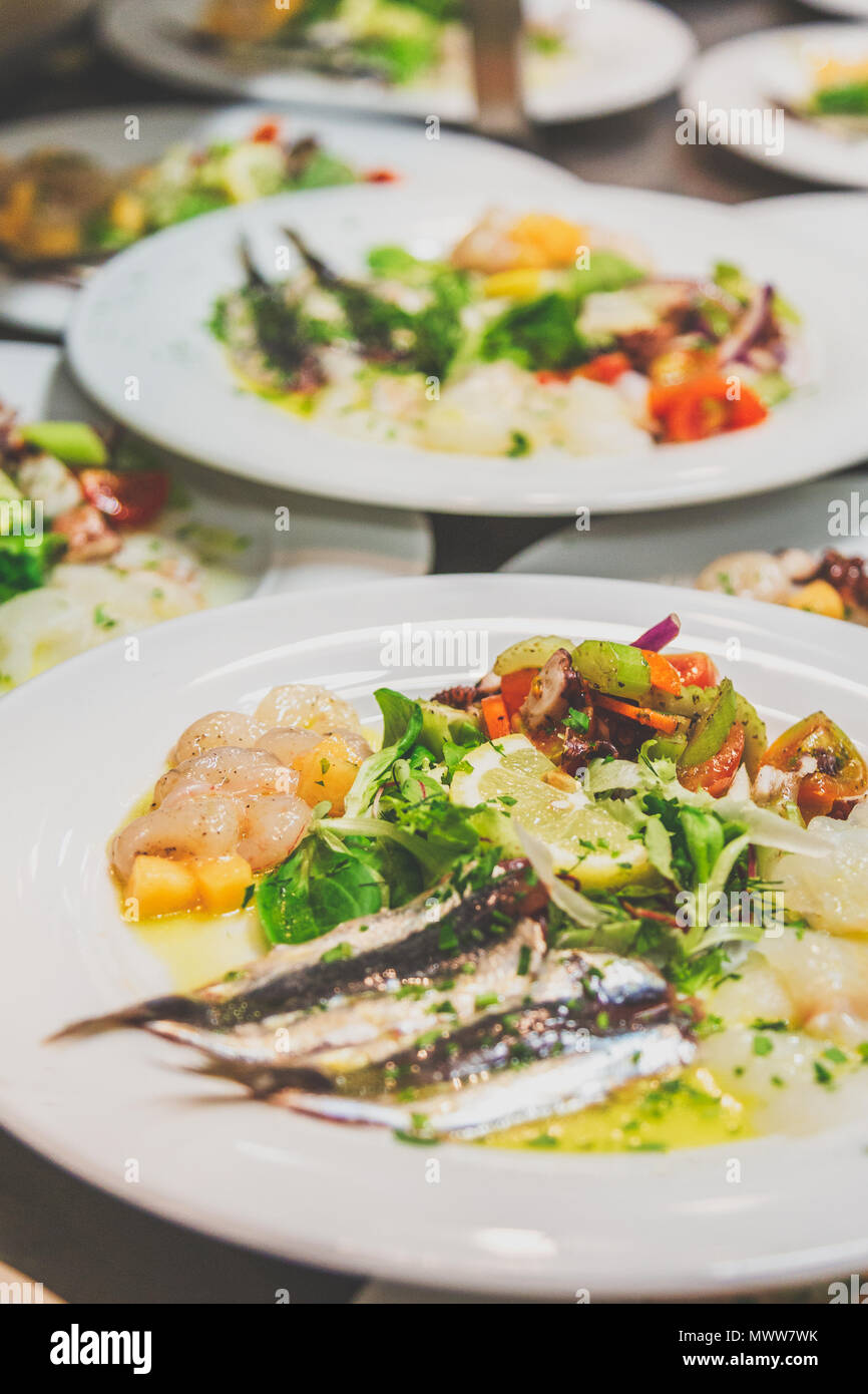 Plates of fish salad appetizers Stock Photo - Alamy