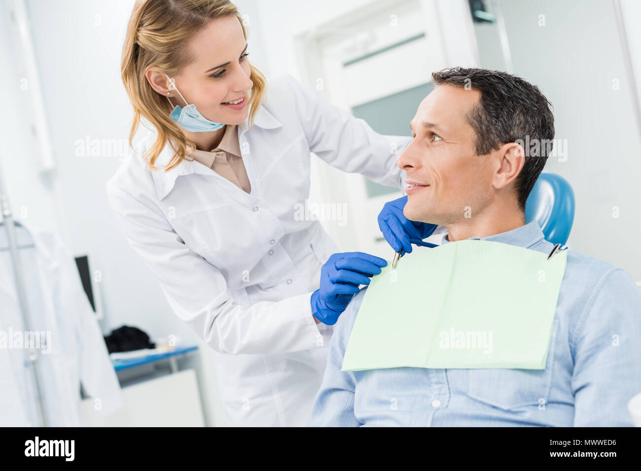 Doctor fixing female patient hi-res stock photography and images - Alamy
