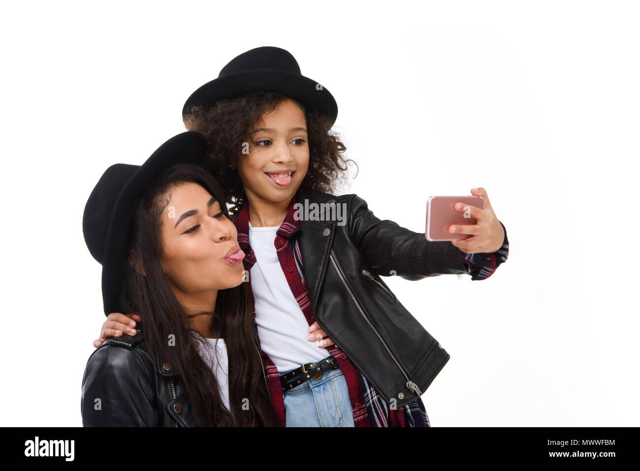 Stylish Mother And Daughter Taking Selfie With Smartphone And Grimacing