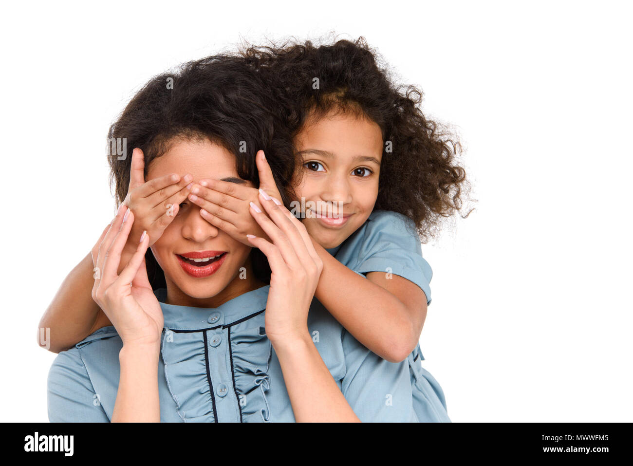Daughter covering eyes mother hands hi-res stock photography and images ...