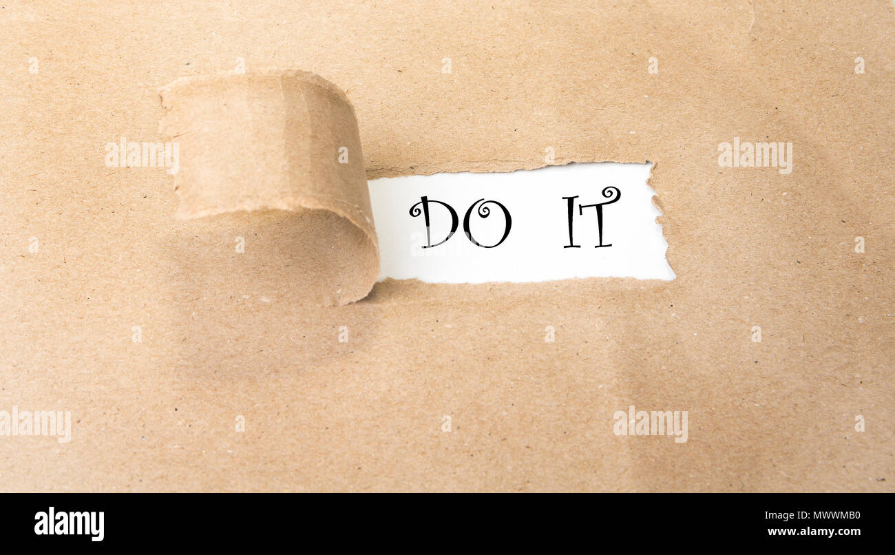 Blank torn brown paper revealing new challenges. Do it Stock Photo - Alamy