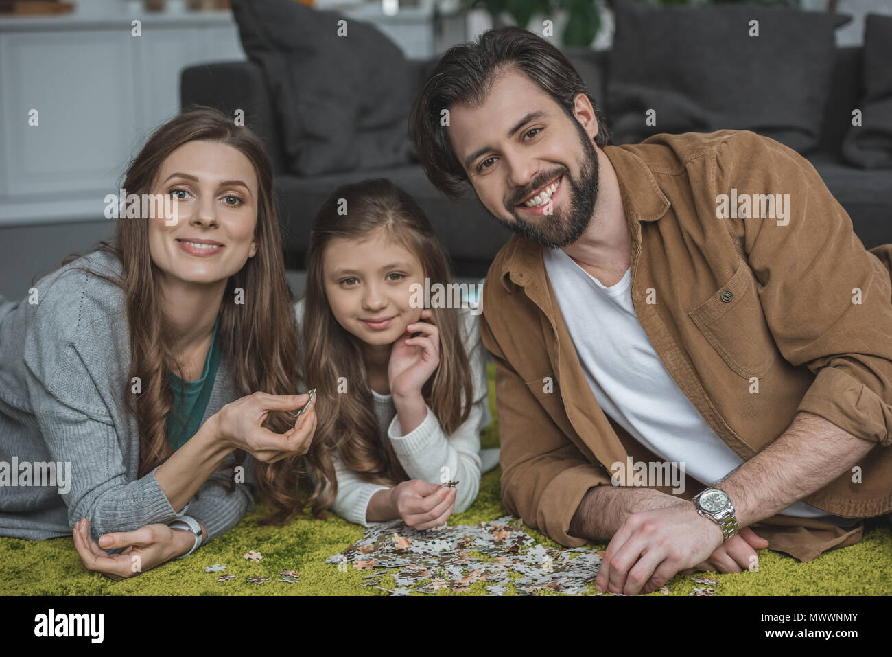 Looking at puzzle pieces hi-res stock photography and images - Alamy