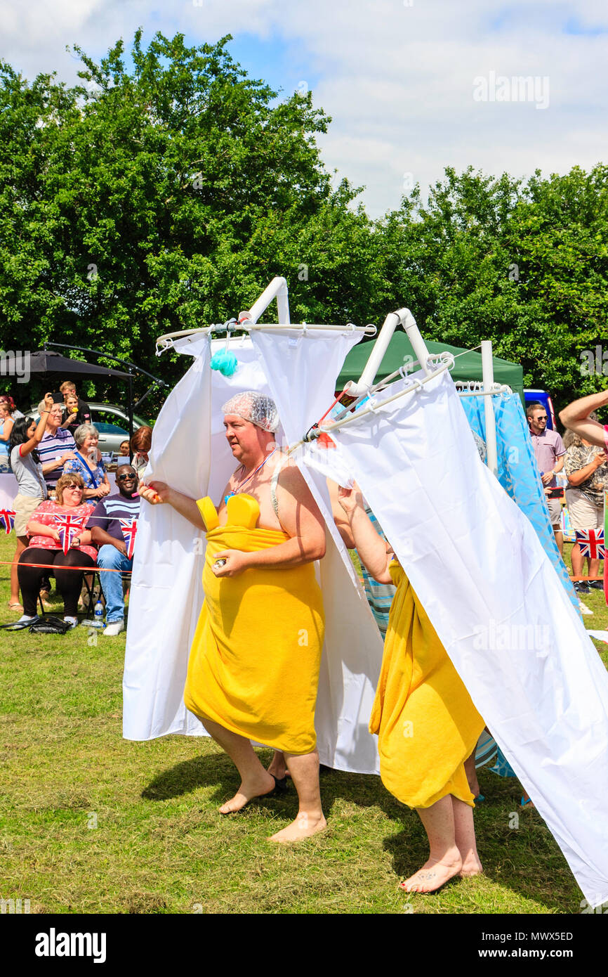 Two people dressed as walking showers in the parade at the World ...