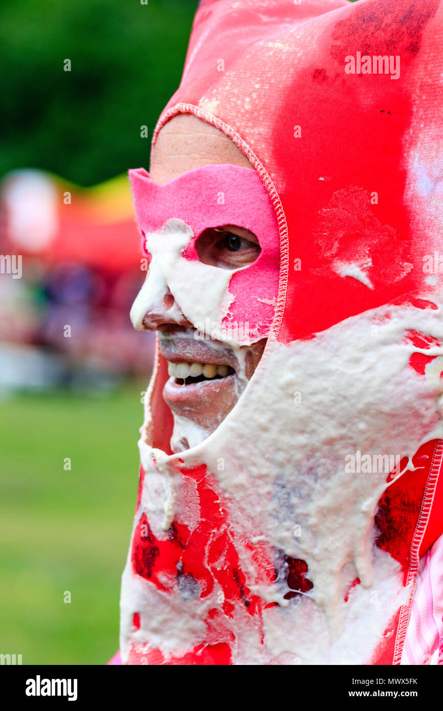 Close up of man's face after being hit on the side by a custard pie ...