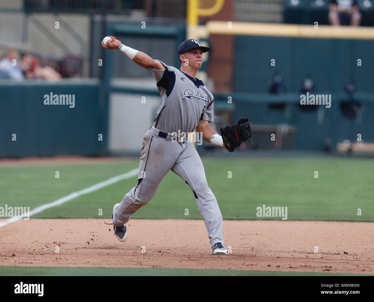 First. 2nd June, 2018. ORU third baseman Cal Hernandez #5 makes a throw ...