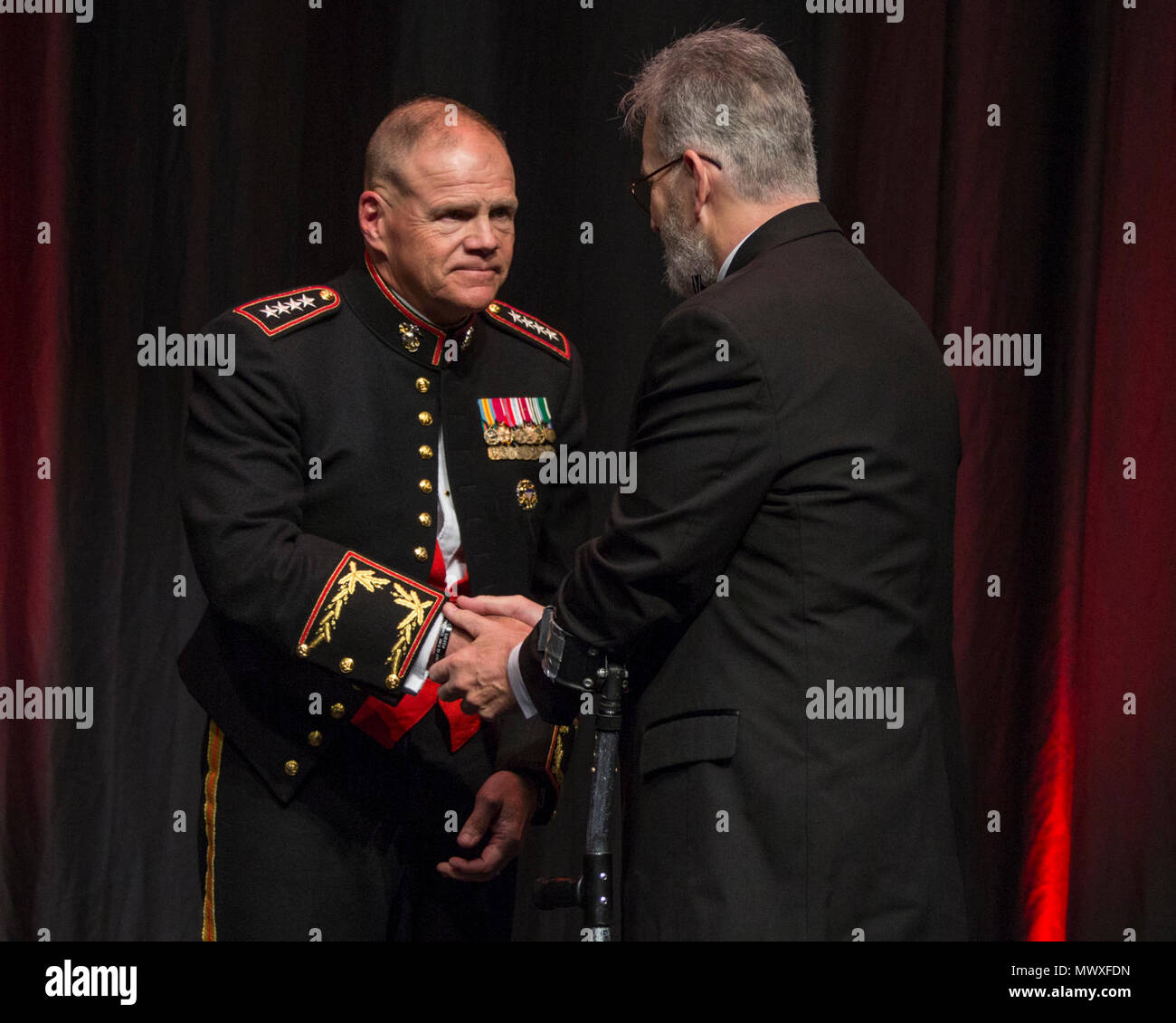 Commandant of the Marine Corps Gen. Robert B. Neller, left, shakes ...