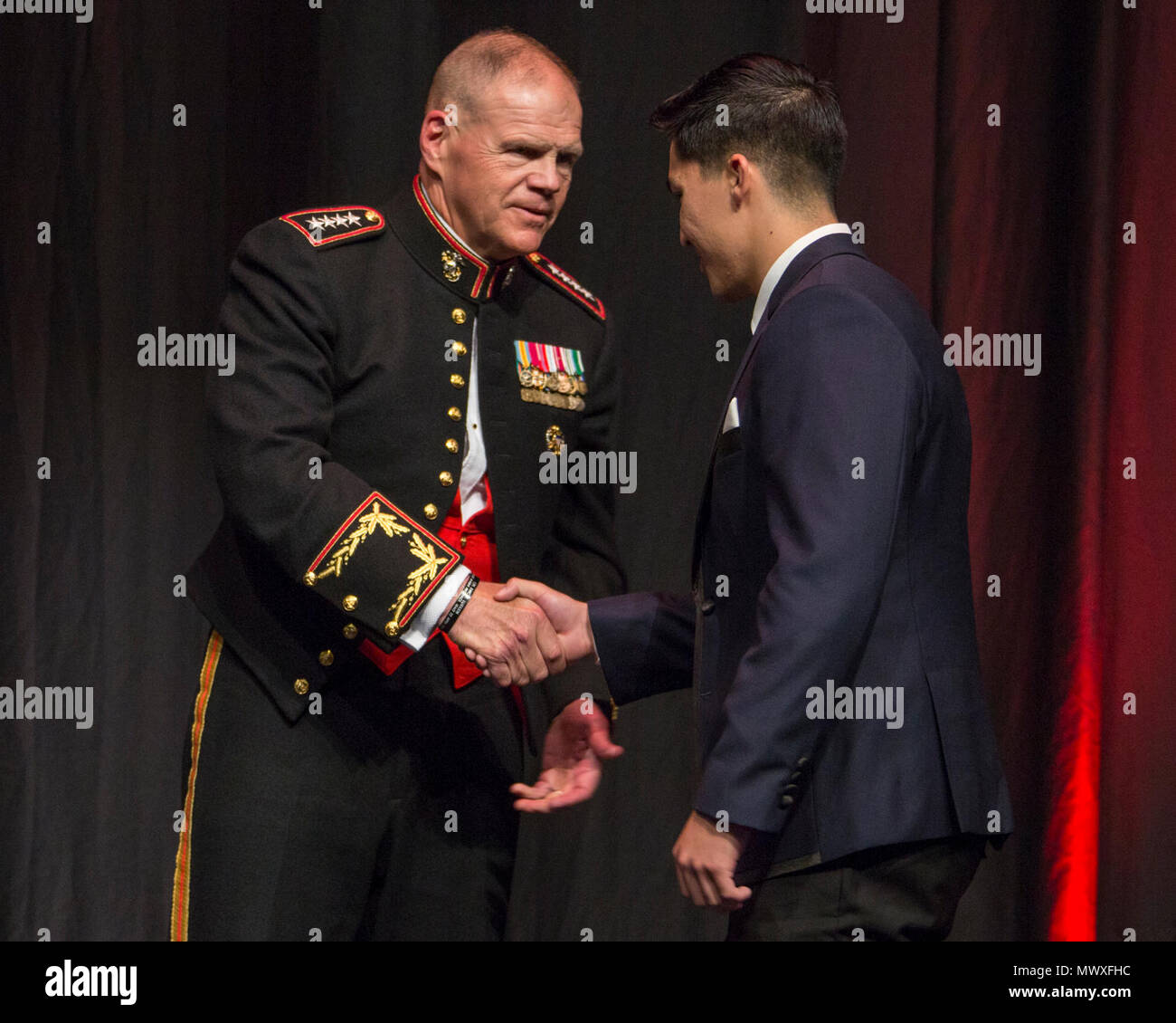 Commandant of the Marine Corps Gen. Robert B. Neller, left, shakes ...