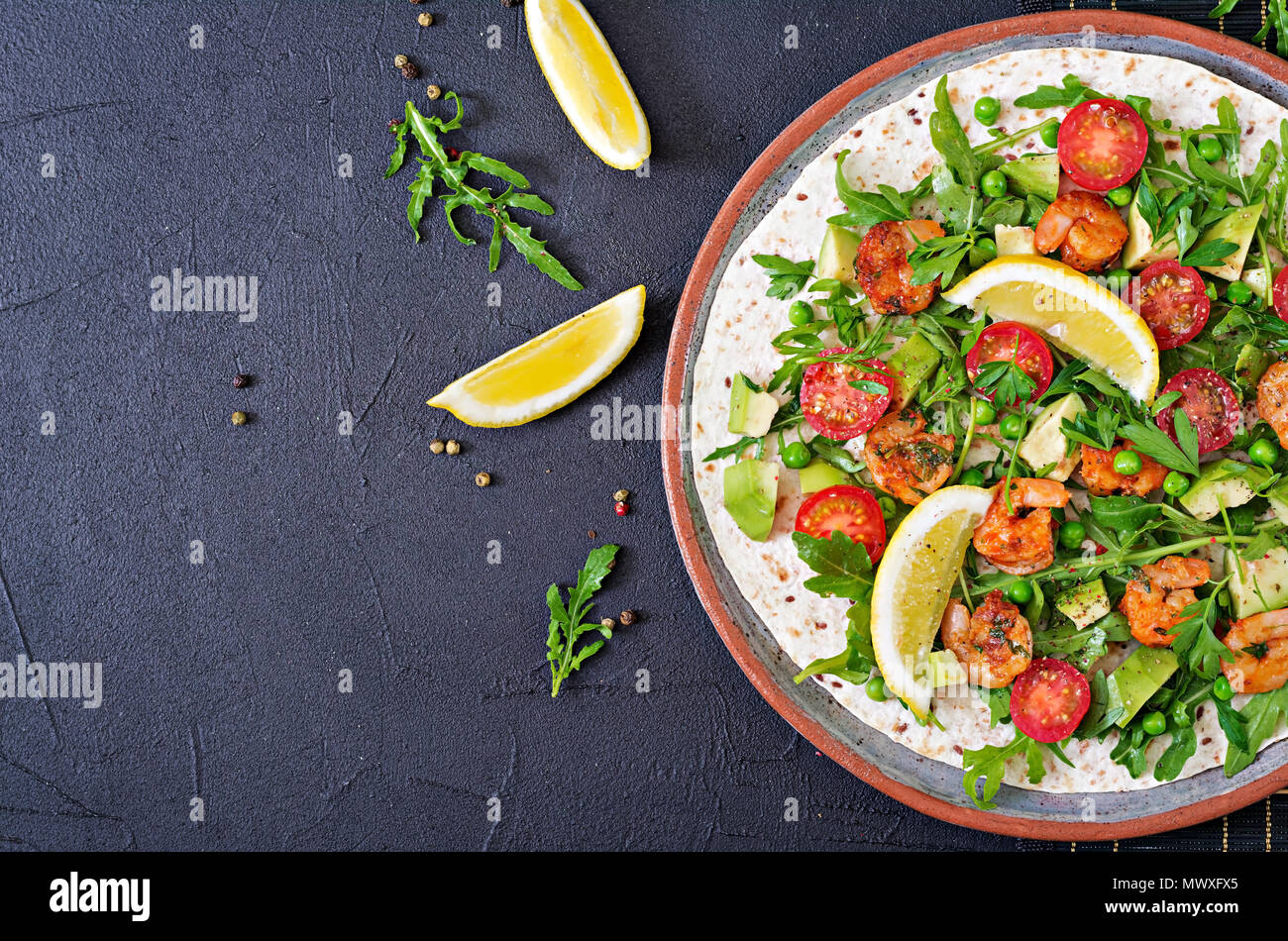 Shrimps tortilla tacos open face wrap with fresh vegetables. Healthy ...