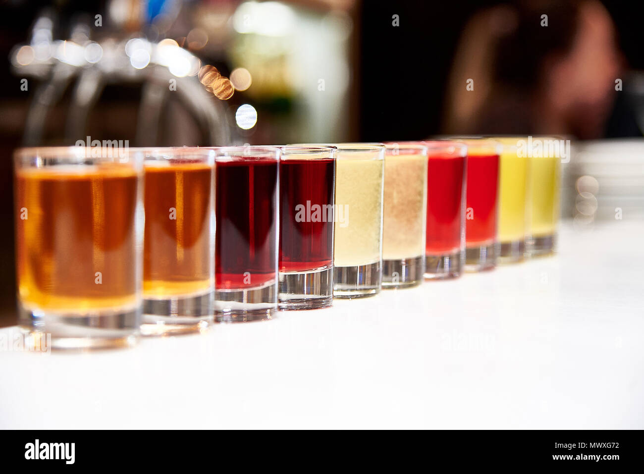 Multicolored alcoholic shots on the bar counter Stock Photo - Alamy