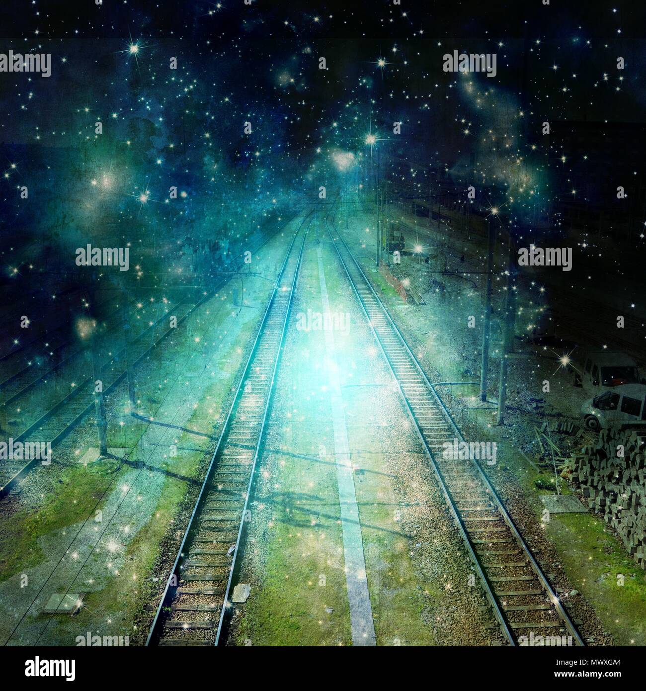 Surreal train tracks go towards the night with star light effect Stock ...