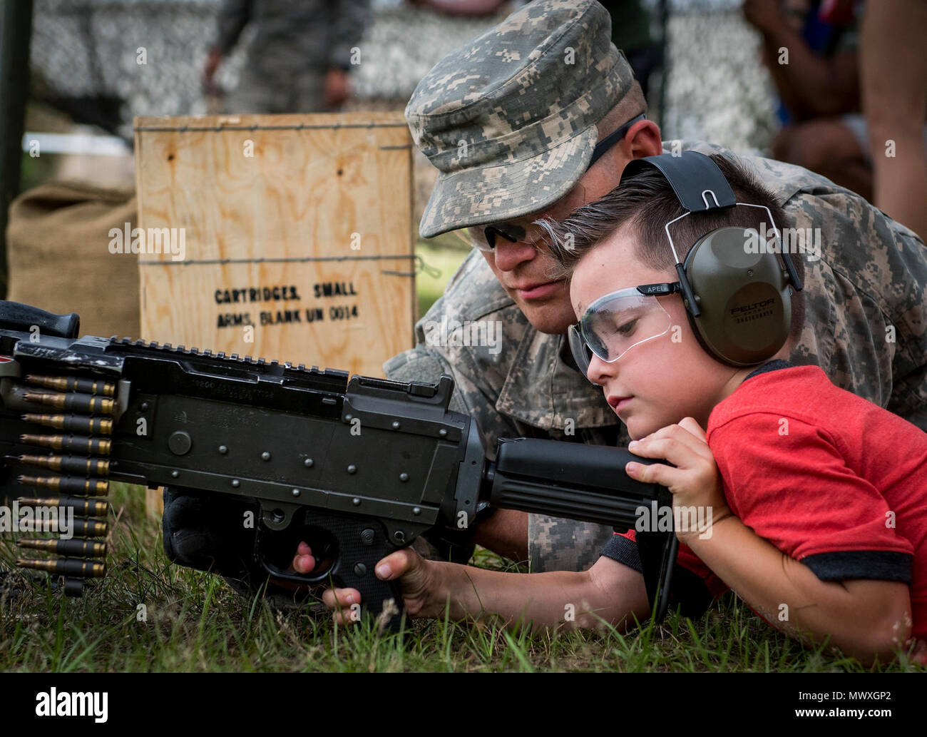 A Soldier talks with a “future Ranger” about a machine gun during the ...