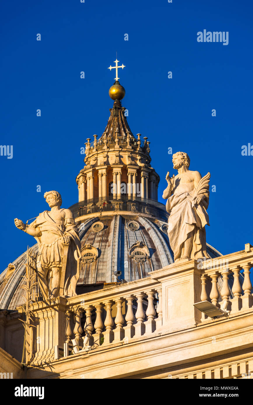 St. Peter's Basilica Cupola and statues in early morning light, Vatican ...