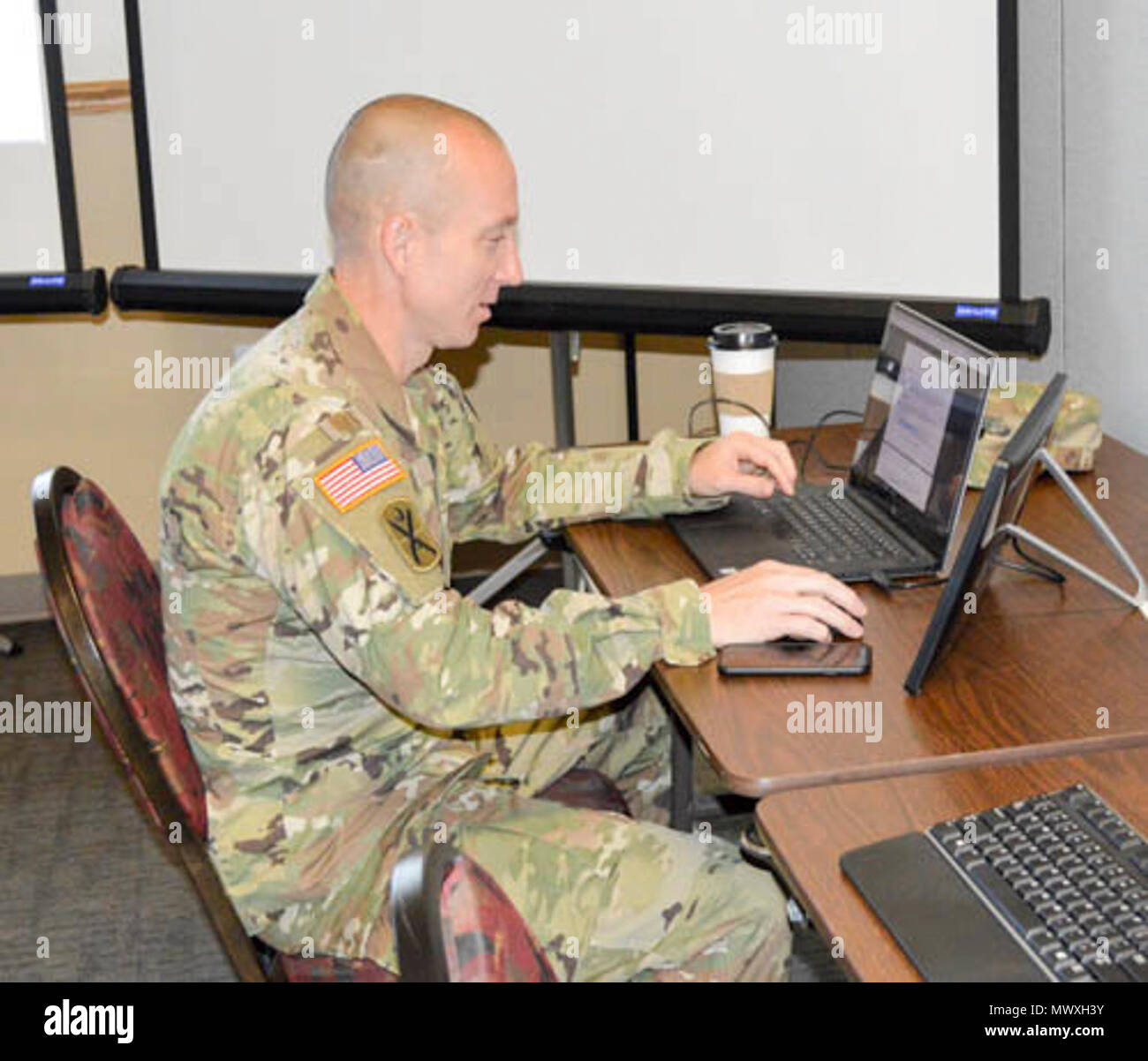 Cpt. Scott Owens, intelligence officer with the 228th Signal Brigade ...