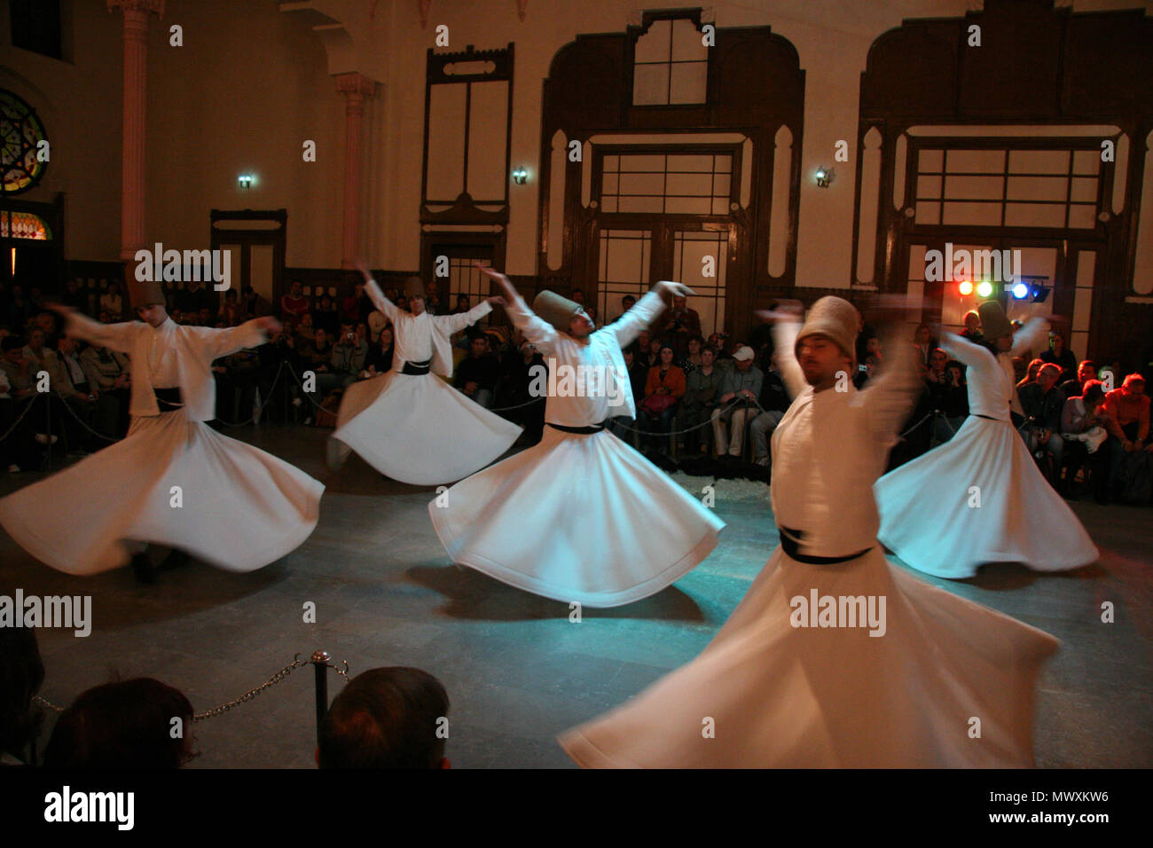 whirling dervishes dancing in traditional turkish dervish costume in ...