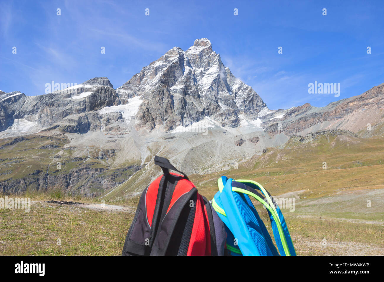 Outdoor two backpack travel on table with landscape high mountain and ...