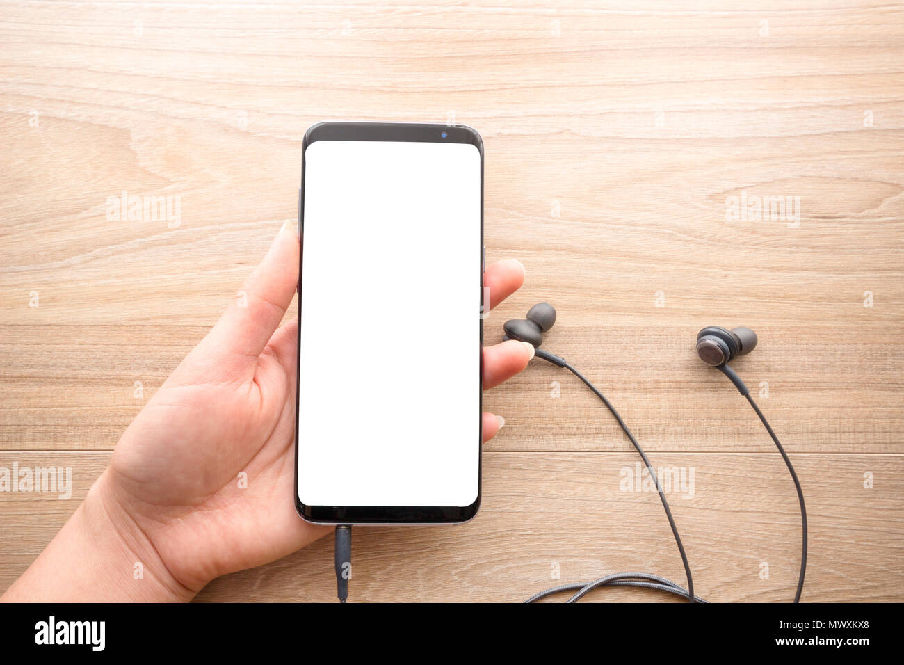 Technology concept, hand torch smartphone or using a new modern smart ...