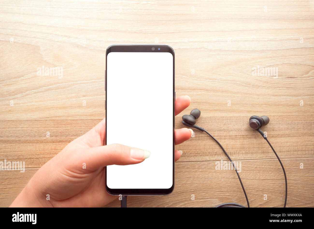 Technology concept, hand torch smartphone or using a new modern smart ...