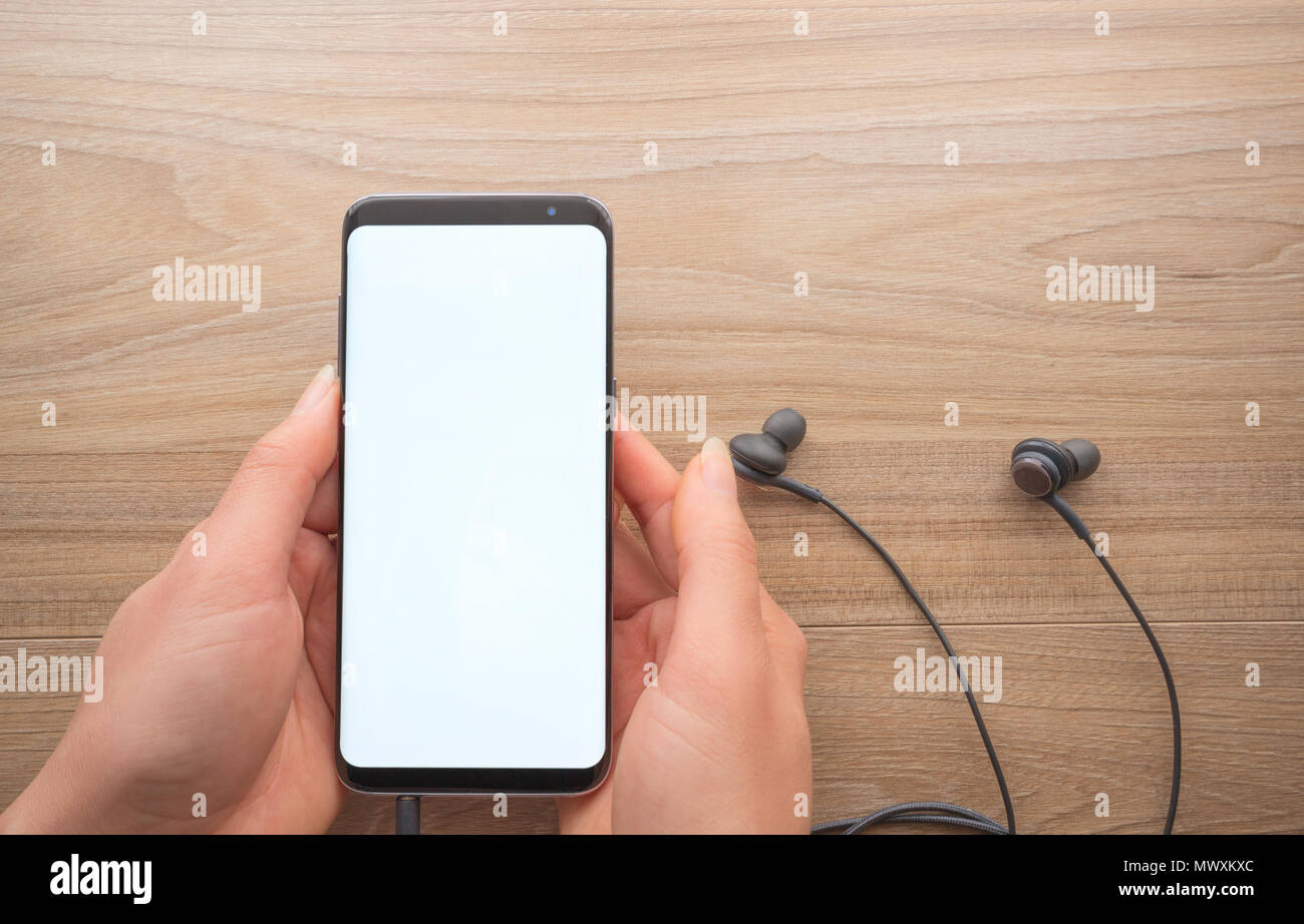 Technology concept, hand torch smartphone or using a new modern smart ...