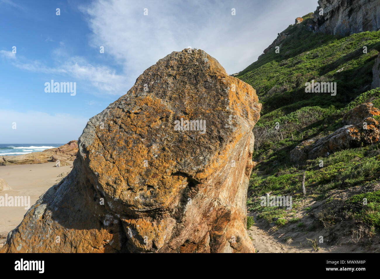 Large rock on the beach in the robberg nature reserve on the garden ...